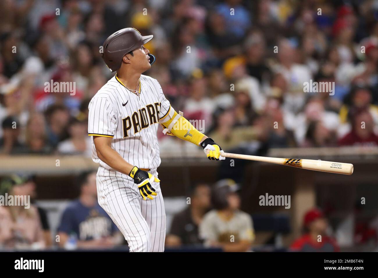 San Diego Padres' Ha-Seong Kim watches his hit in a baseball game ...