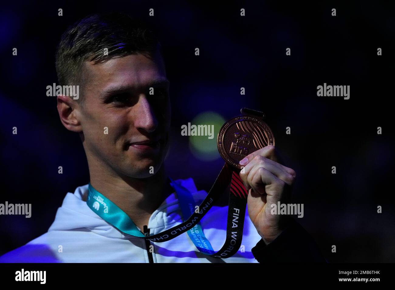 Florian Wellbrock of Germany celebrates a third place after the men's ...