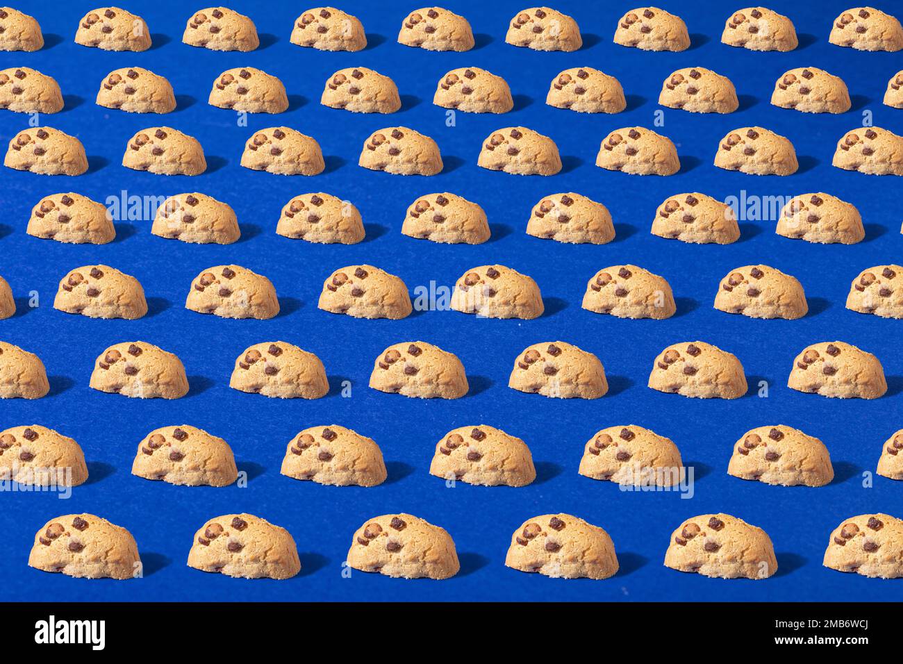 Homemade cookie with chocolate. Photo on a blue background. Modern food ...