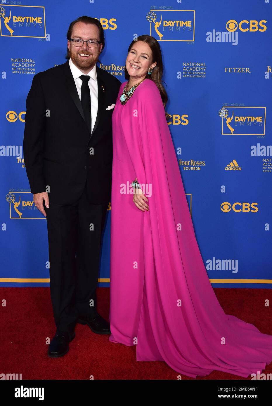 Adam Sharp, president and CEO of NARAS, left, and Drew Barrymore pose ...