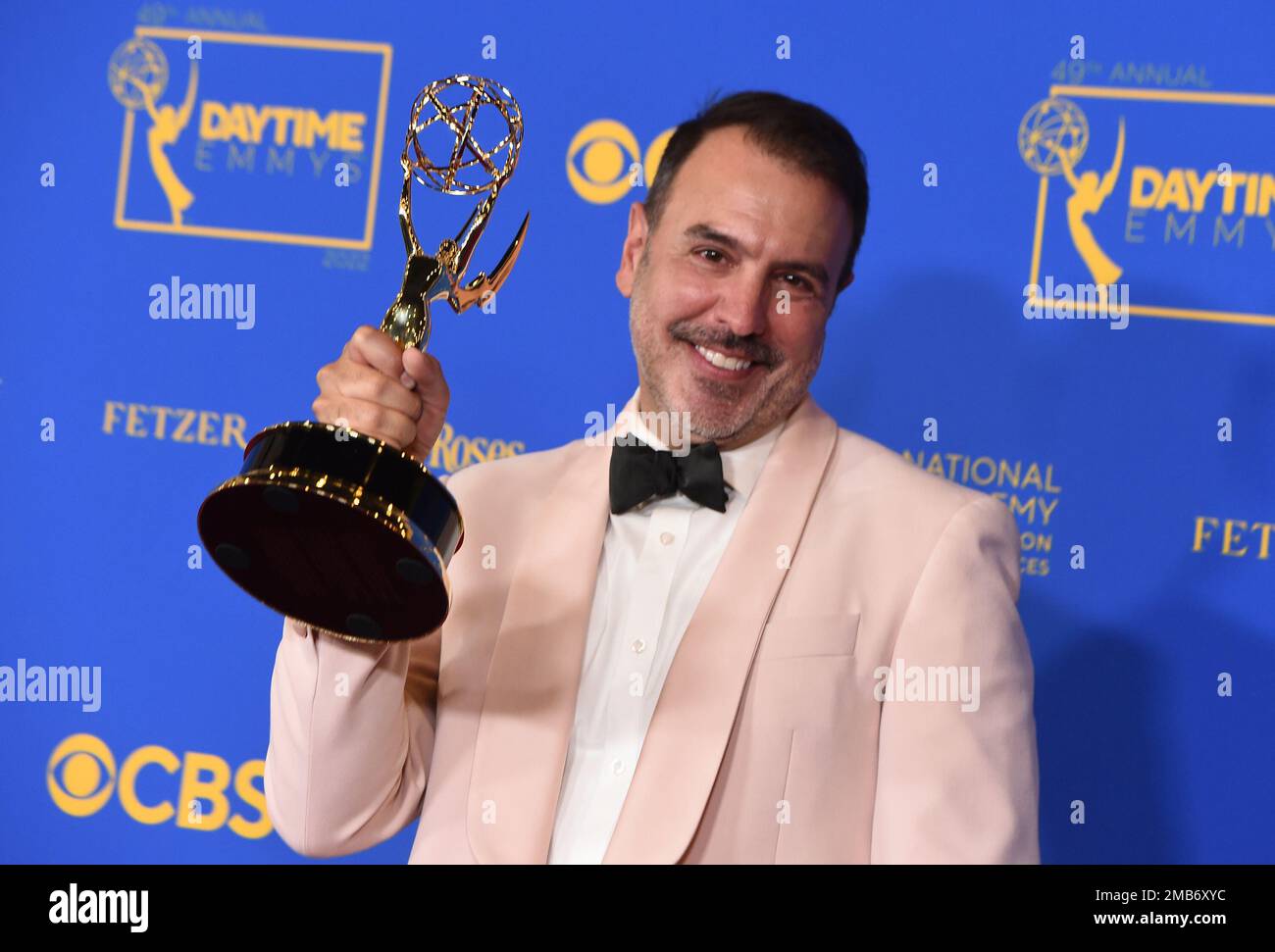 Ron Carlivati poses in the press room with the award for outstanding ...