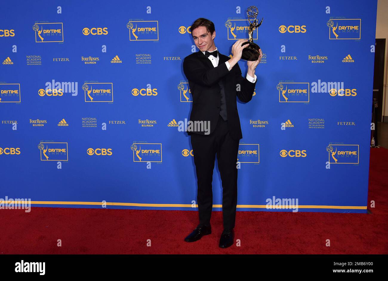 Nicholas Chavez poses in the press room with the award for outstanding ...