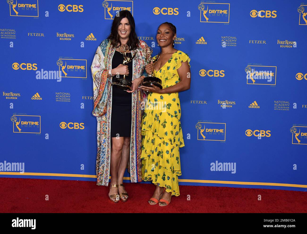 Alex Duda, left, and Kareen Gunning pose in the press room with the ...