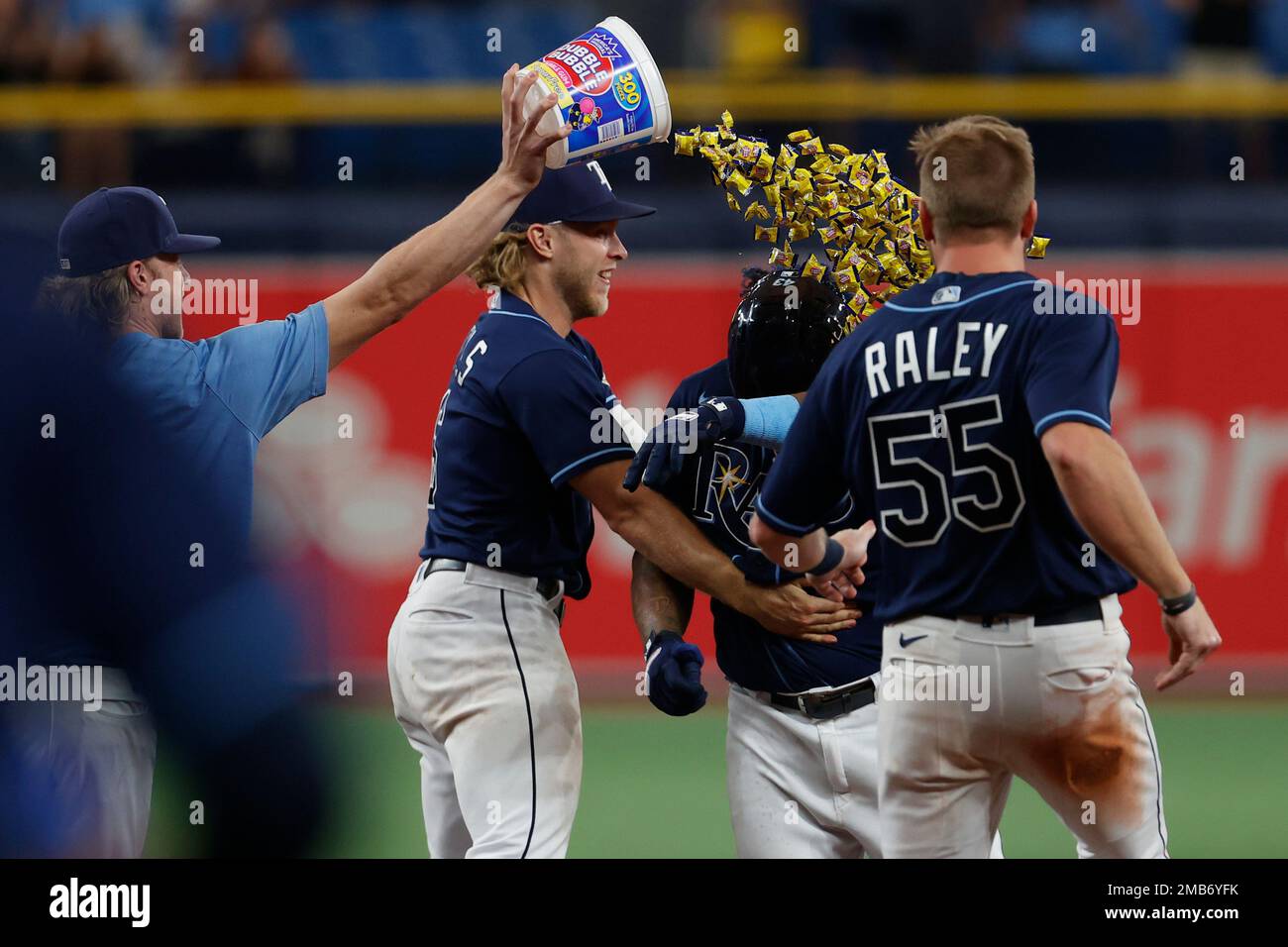 Tampa Bay Rays' Harold Ramirez, second from right, is showered with ...