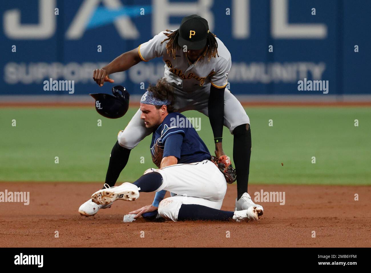 Tampa Bay Rays' Josh Lowe safely steals second beating the tag of ...