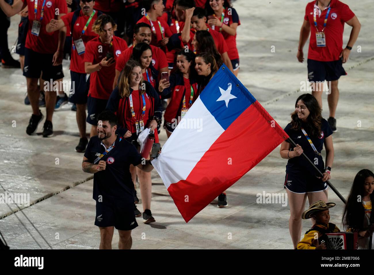 Katina Proestakis and Rodrigo Rojas, of Chile, carry their national ...