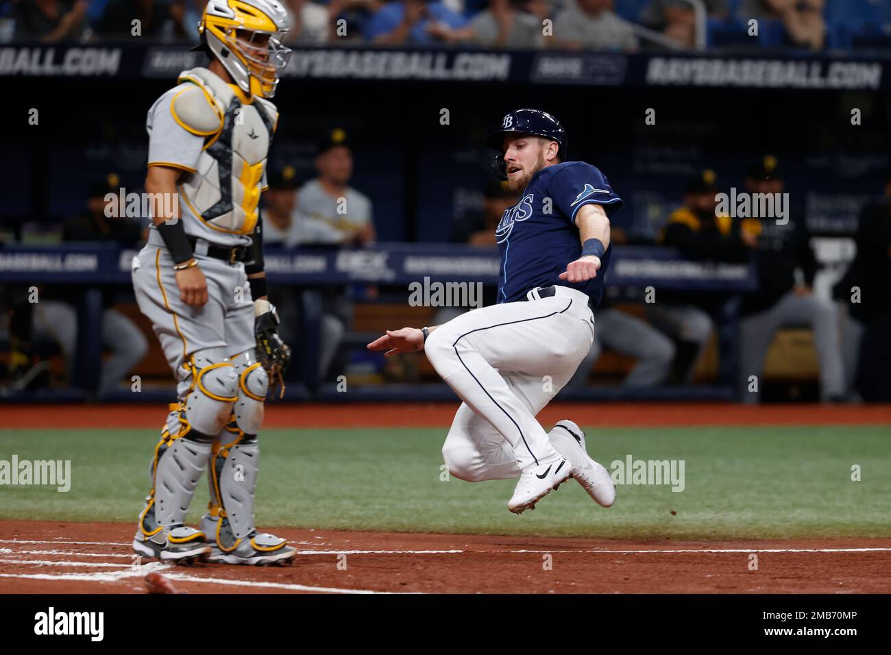 Tampa Bay Rays' Luke Raley slides past Pittsburgh Pirates catcher ...