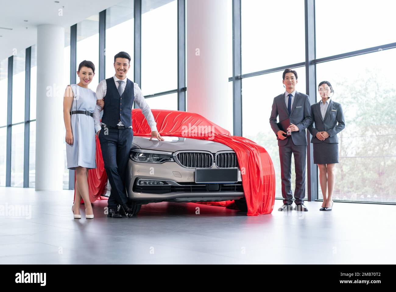A young couple of choose and buy cars Stock Photo - Alamy