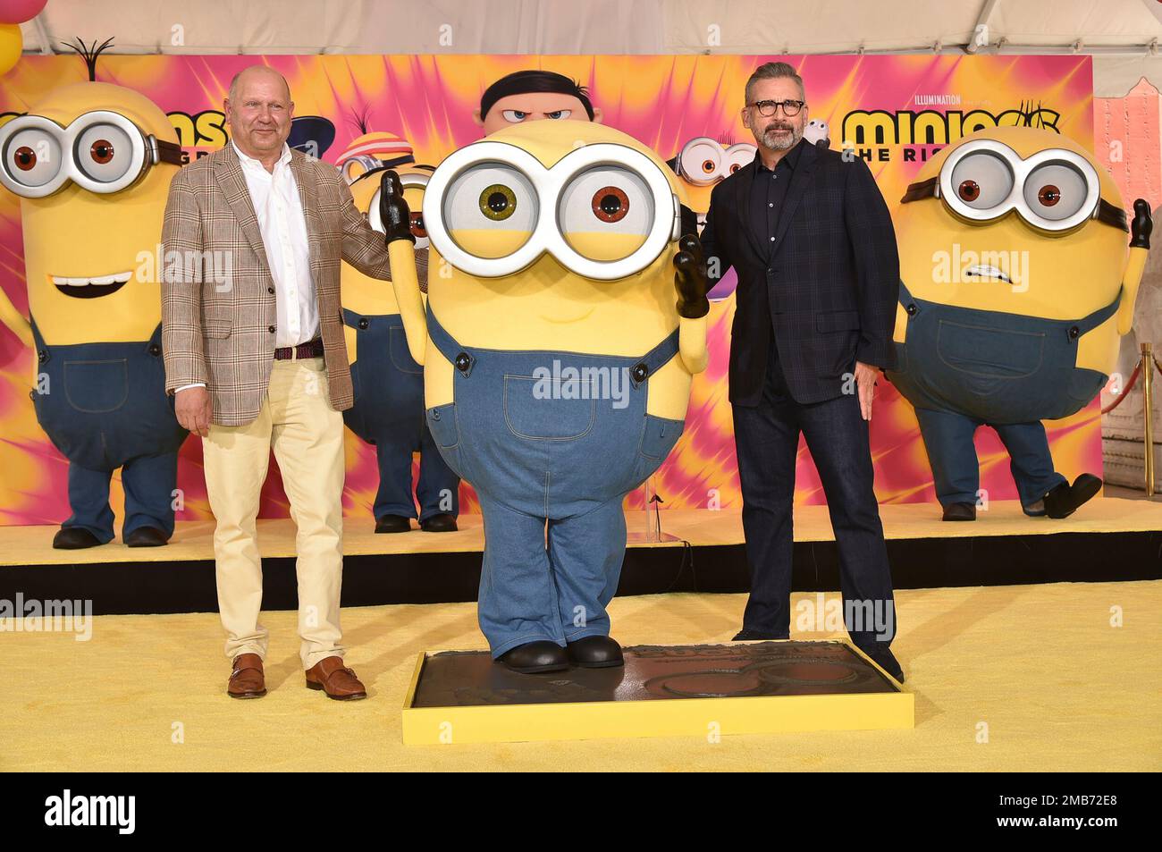 Chris Meledandri, left, Bob the Minion and Steve Carell pose for photos ...