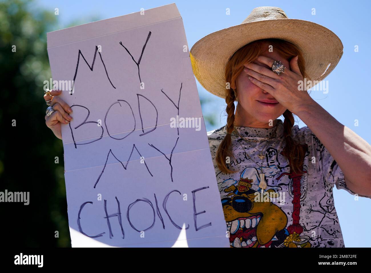 Abortion-rights advocate Eleanor Wells, 34, gets emotional during a ...