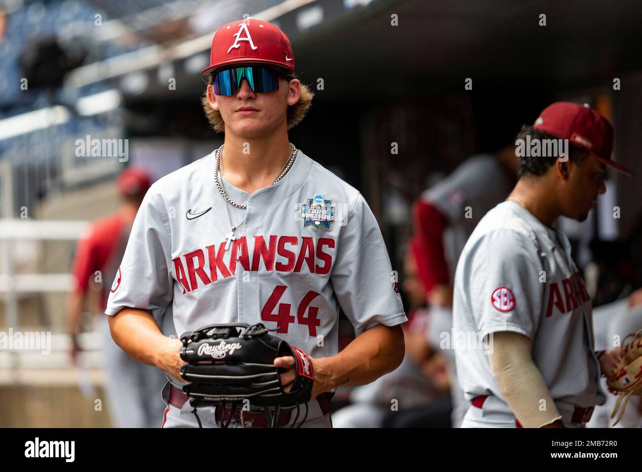 Arkansas Max Soliz Jr. (44) in the dugout getting ready for the game ...