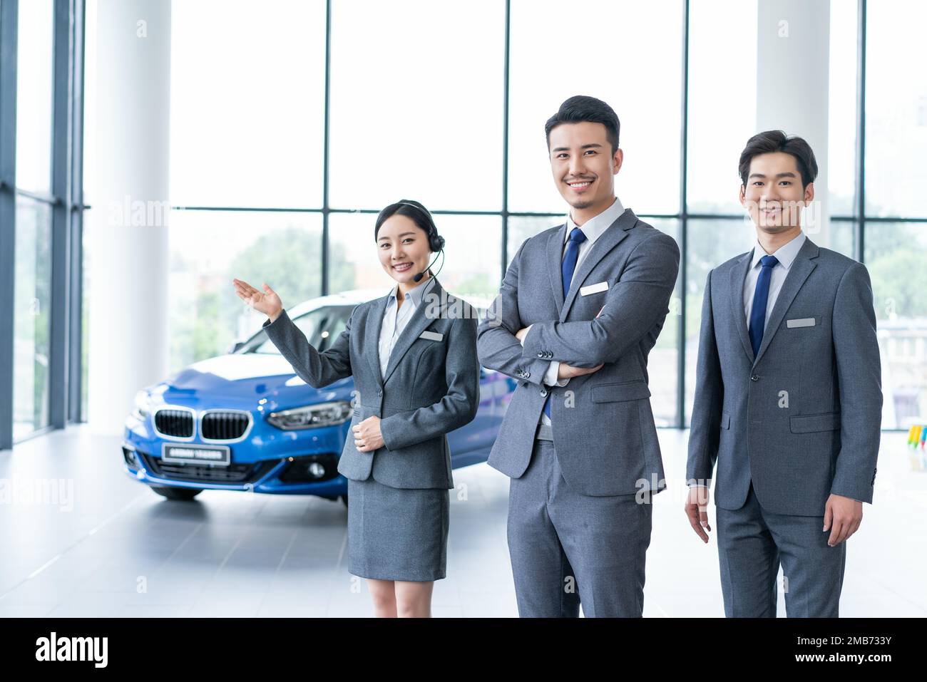 Young business people work in the 4 s shop Stock Photo - Alamy