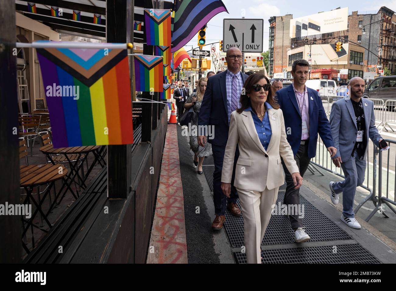 New York State Governor Kathy Hochul walks past pride flags after the ...