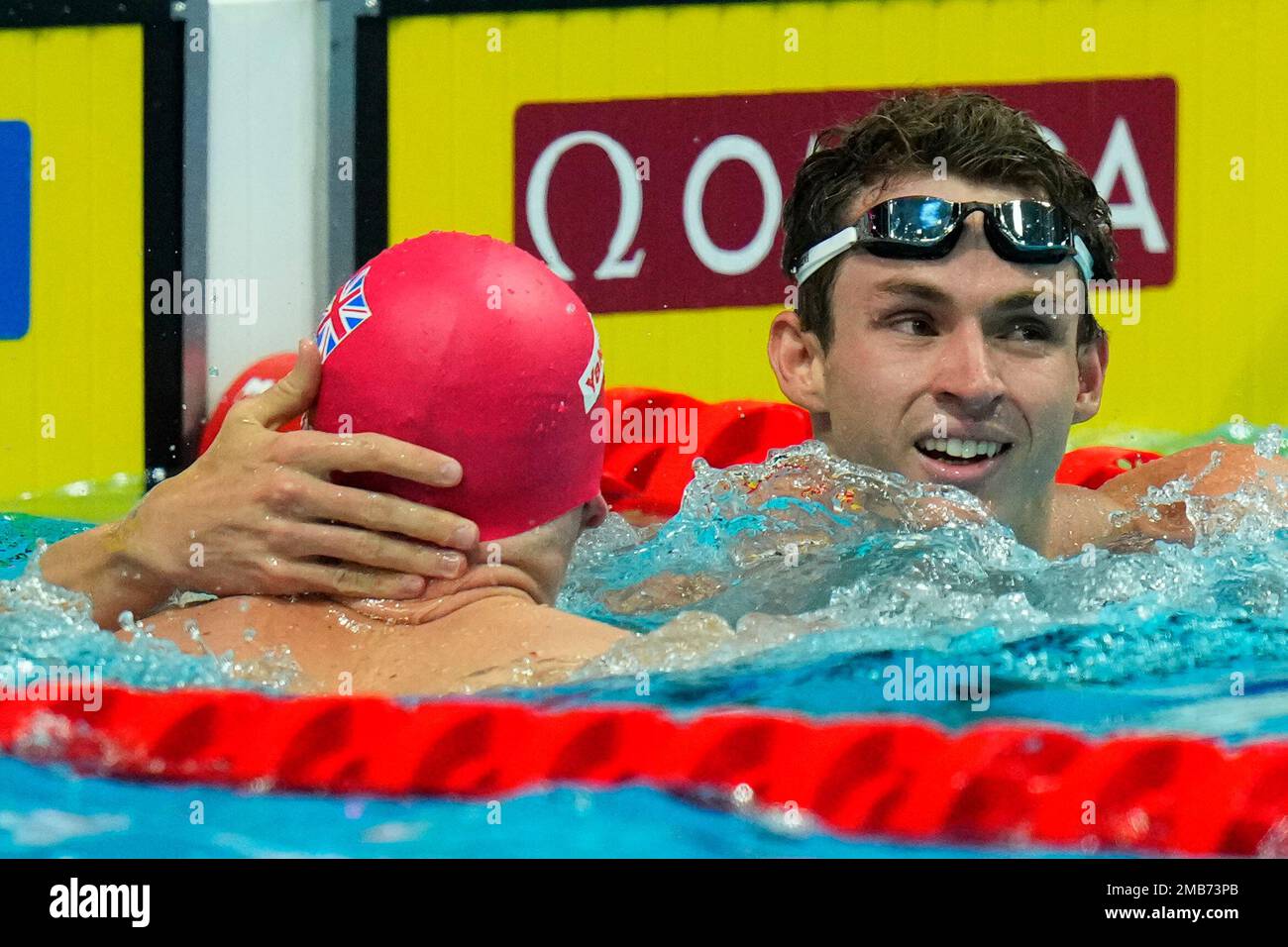 Benjamin Proud, right, of Britain celebrates with Lewis Edward Burras ...