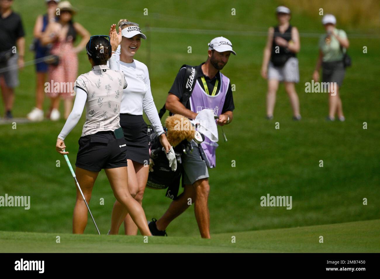 Lydia Ko, of New Zealand, left, greets Jessica Korda, center, after a ...