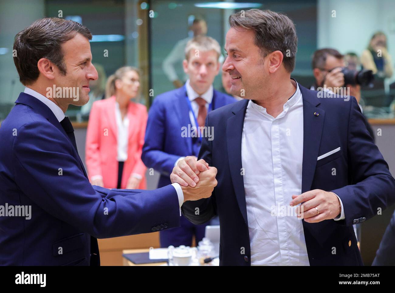French President Emmanuel Macron, left, greets Luxembourg's Prime ...