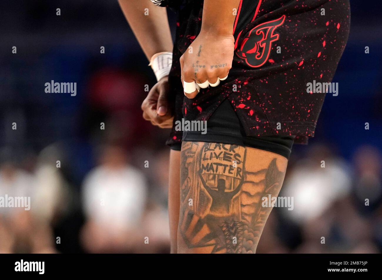 A tattoo on the leg of Indiana Fever's NaLyssa Smith can be seen that ...