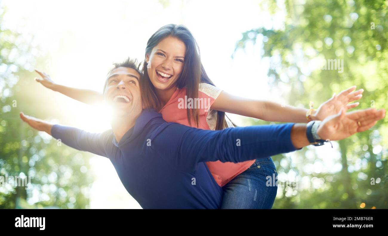 Handsome guy giving piggyback hi-res stock photography and images - Alamy