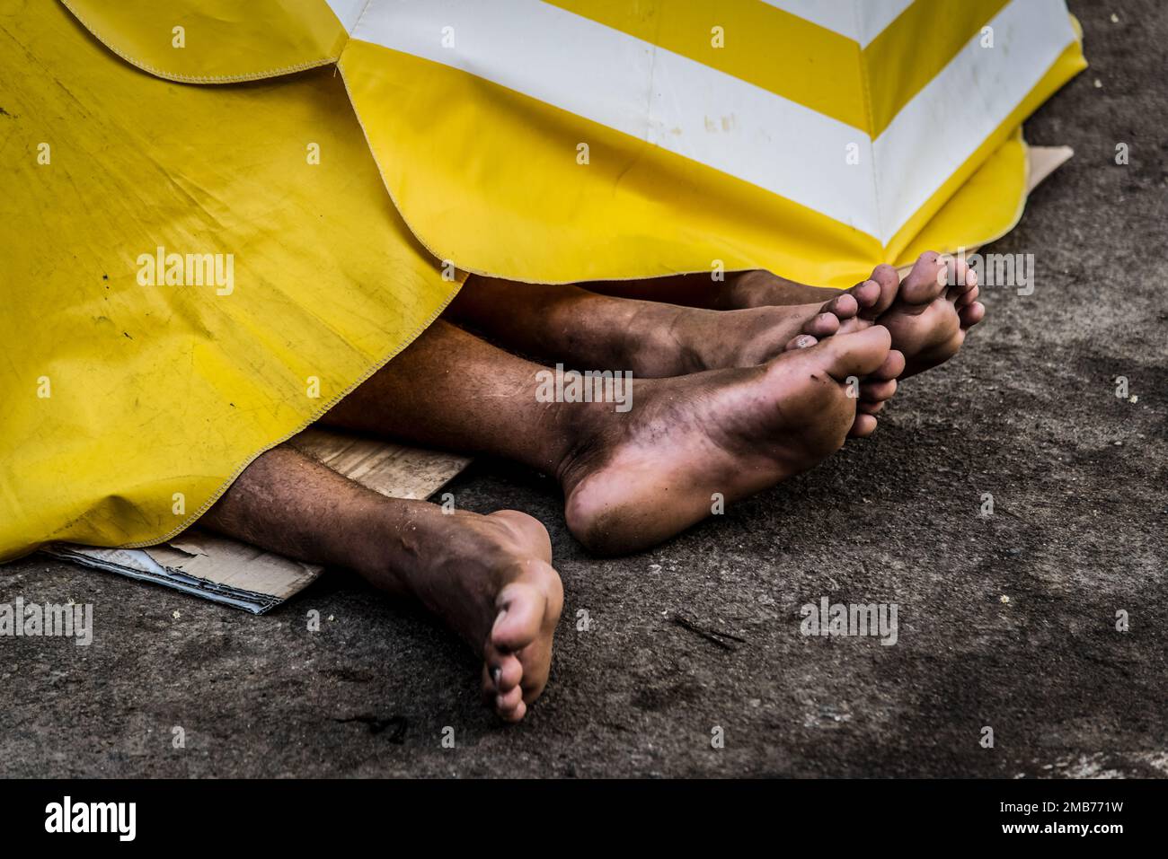 Two homeless people sleep in hi-res stock photography and images - Alamy
