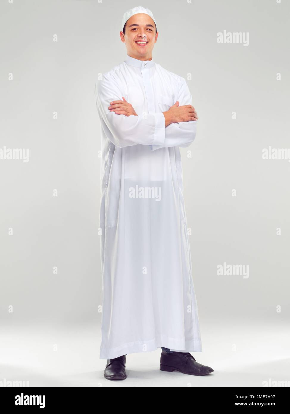 Islamic man, smile portrait and muslim fashion standing in white ...