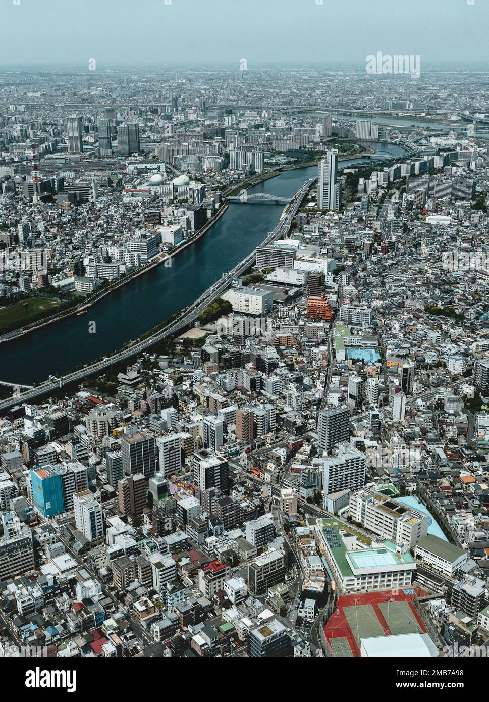 A vertical and aerial view of city buildings and the river Stock Photo ...