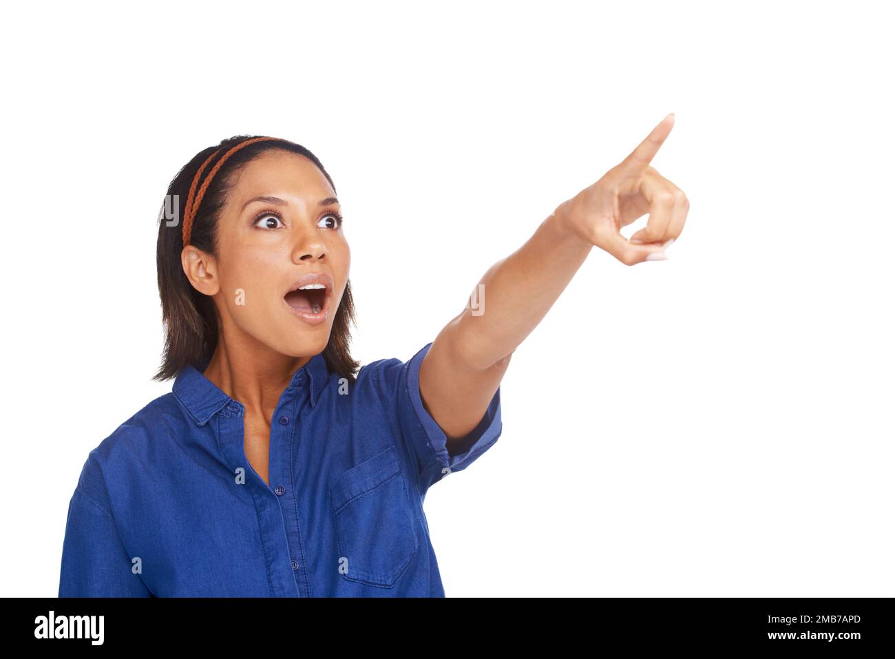 Touching the future. An excited young woman pointing at something while ...