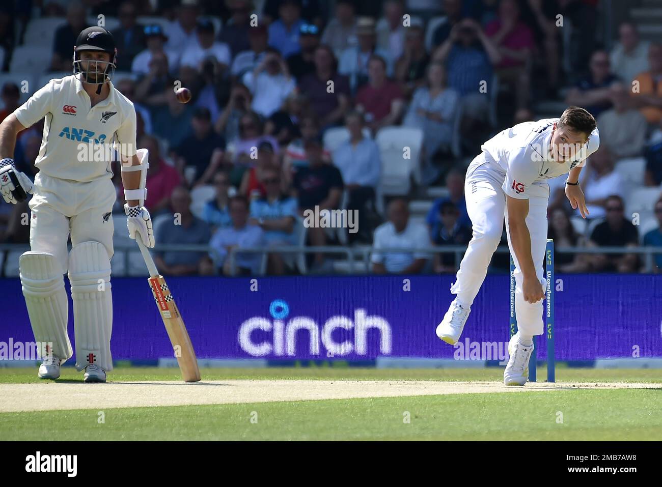England's Matthew Potts, right, bowls a delivery during the first day ...