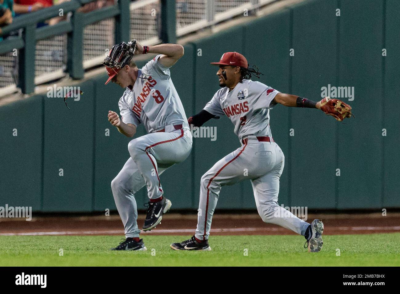 Arkansas left fielder Jace Bohrofen (8) makes a catch while trying to ...