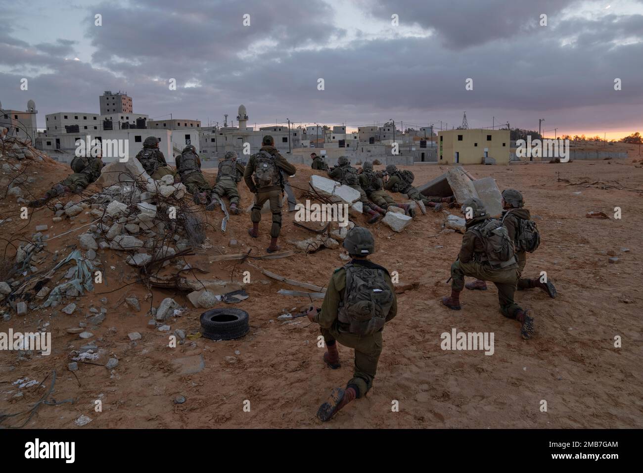 Israeli soldiers take positions during a training session simulating ...