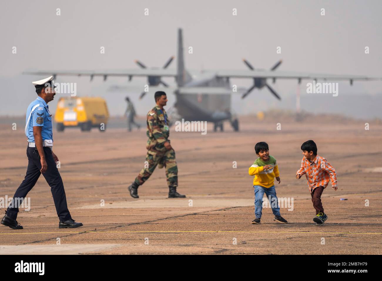 Children play by an aircraft during an aerobatic aerial display at the ...