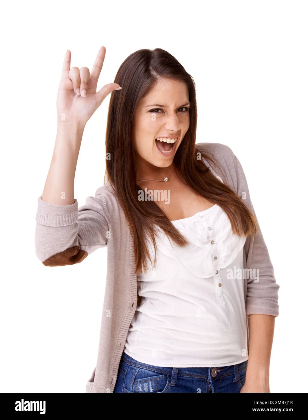 Rocking on. Smiling young woman giving a rock-on symbol against a white ...