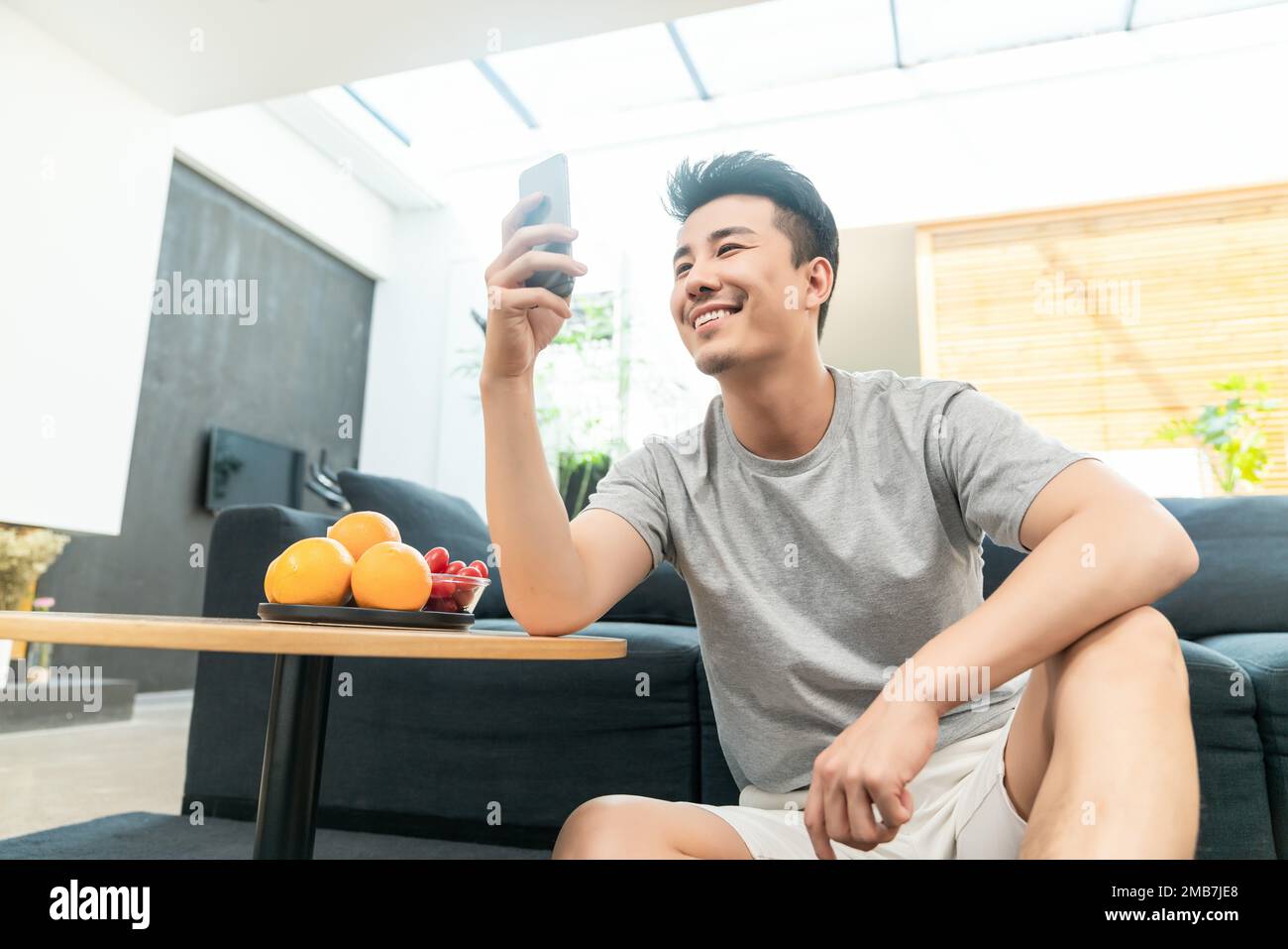 Family sitting mobile phones hi-res stock photography and images - Alamy