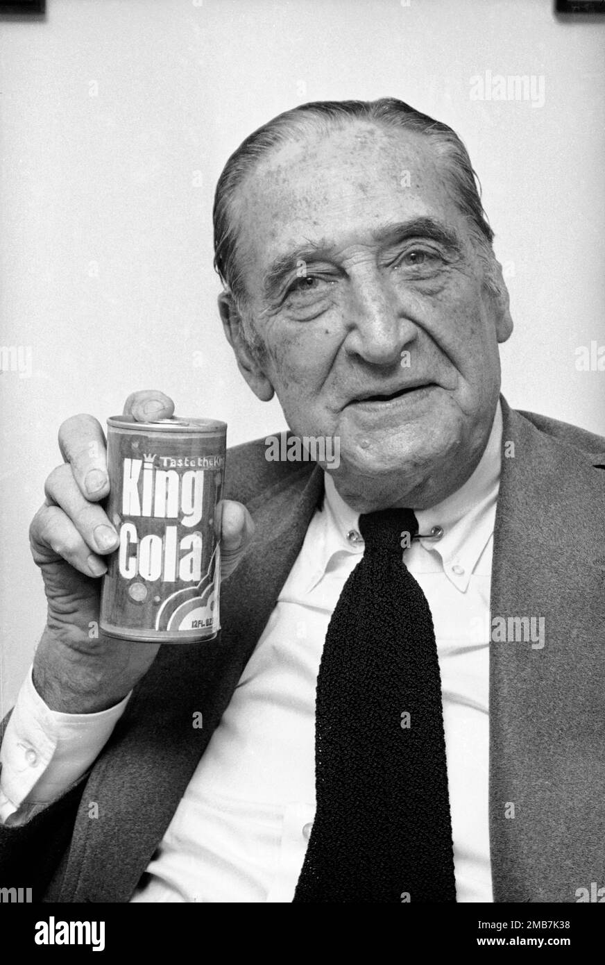Walter S. Mack Jr., 82, President of King Cola Inc., displays one of ...