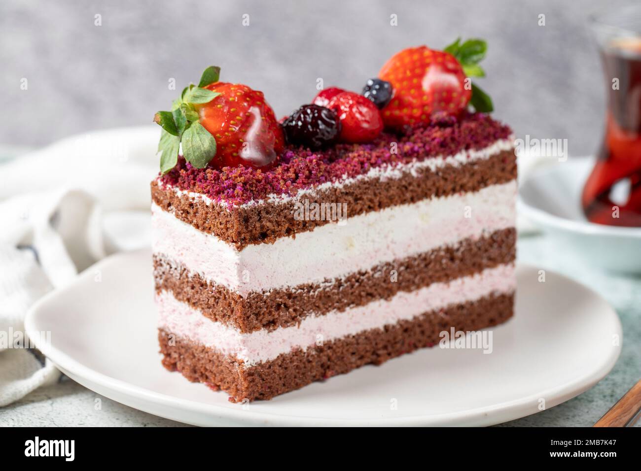 Fruit and whipped cream cake. Layered cake with forest fruit and cream ...