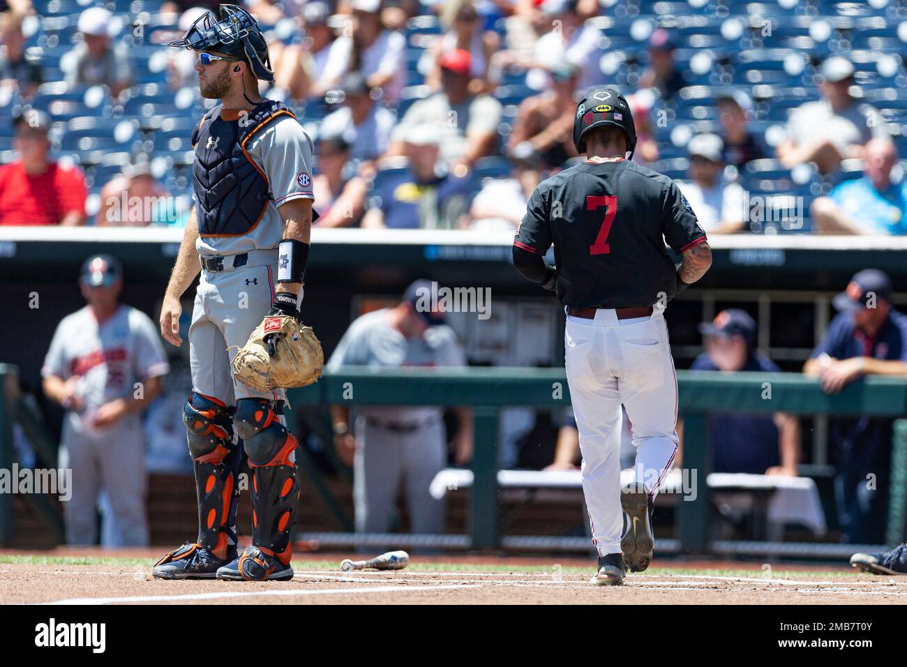 Stanford's Brock Jones (7) scores a run against Auburn catcher Nate ...