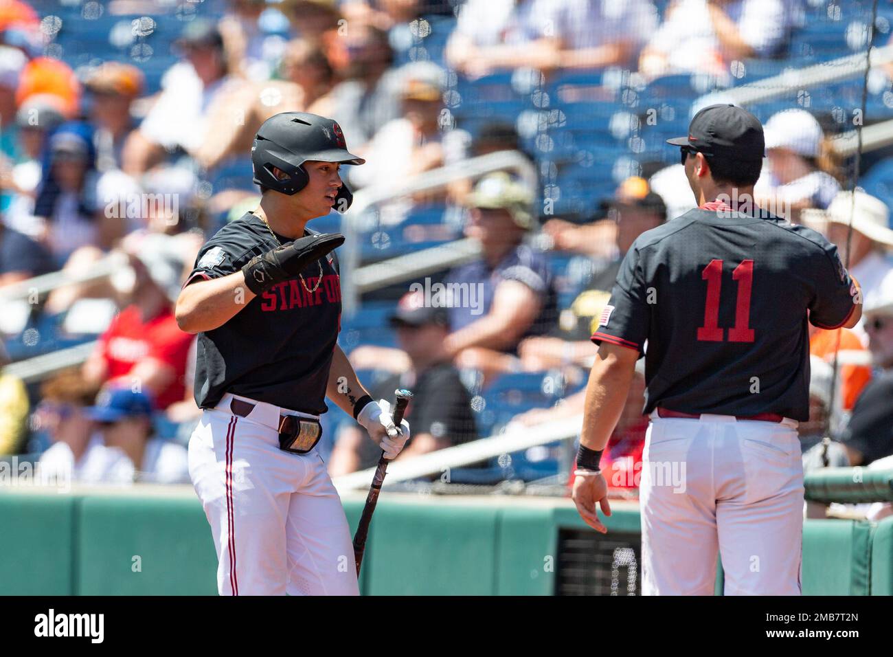 Stanford infielder Tommy Troy celebrates scoring a run with Stanford ...