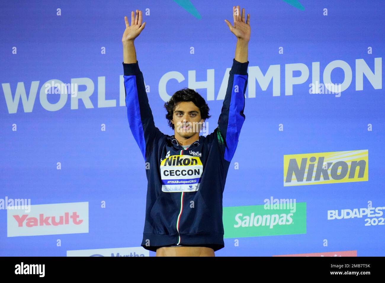 Thomas Ceccon of Italy waves from the podium after winning the Men 100m ...