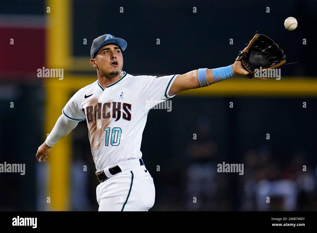 Arizona Diamondbacks third baseman Josh Rojas reaches out to catch a ...