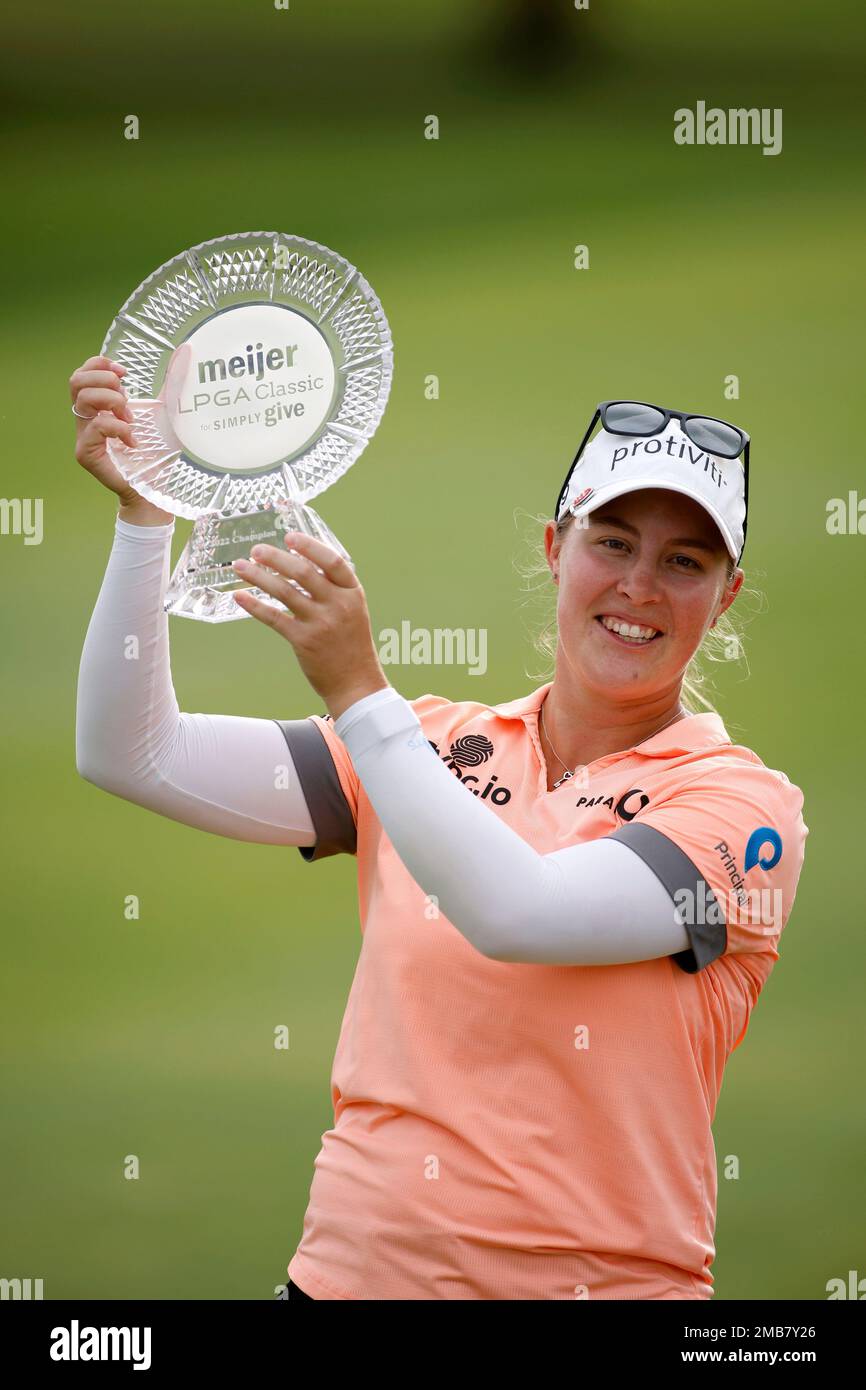 Jennifer Kupcho holds the trophy after winning the Meijer LPGA Classic golf tournament, Sunday ...