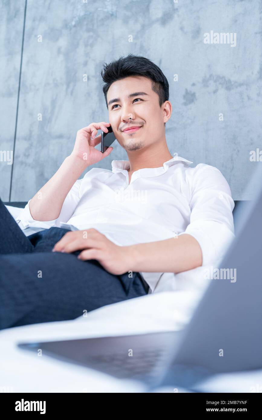 Business man in the hotel the use of mobile phones Stock Photo - Alamy
