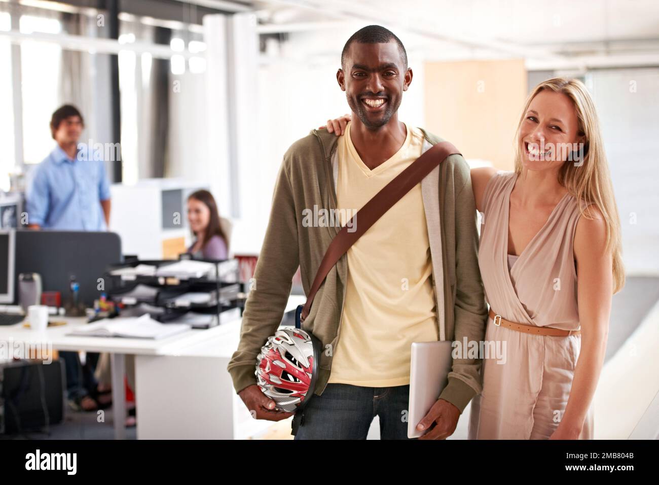 Forging friendships in the workplace. Two friendly business colleagues ...