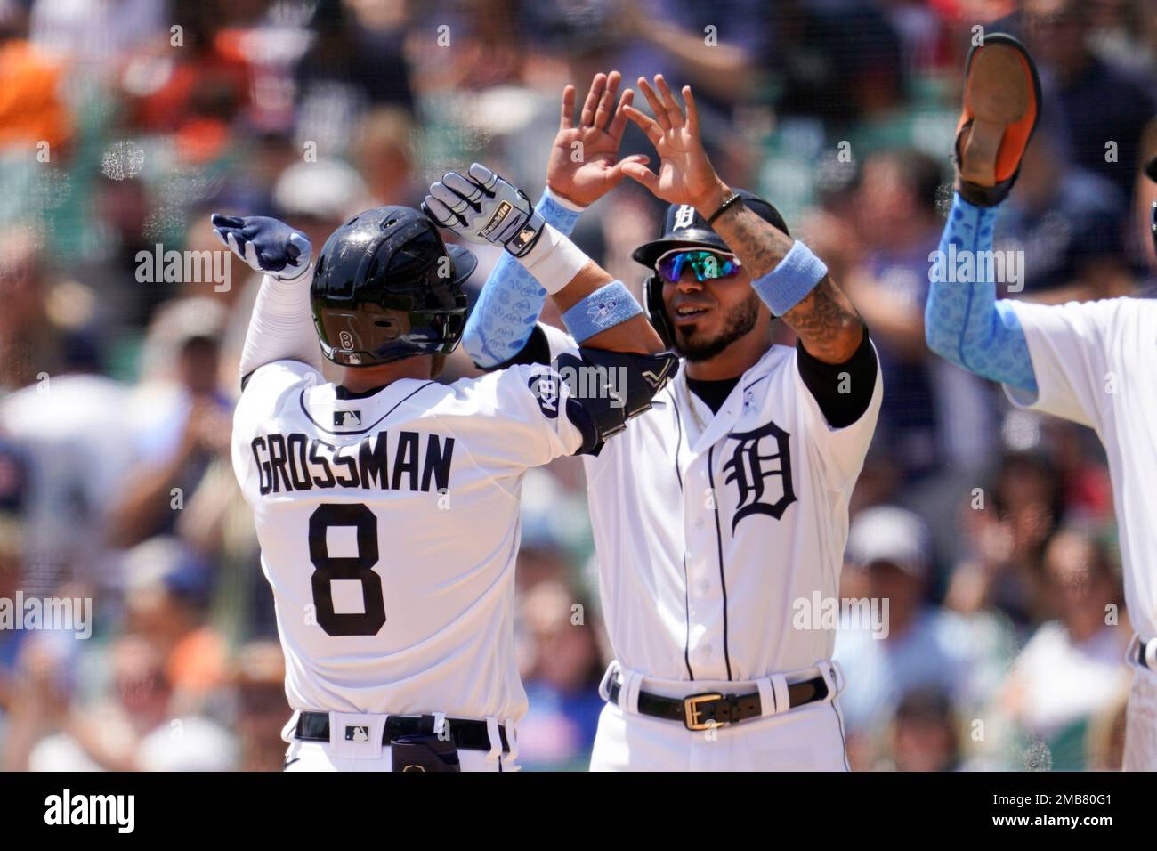 Detroit Tigers' Robbie Grossman (8) celebrates his three-run home run ...