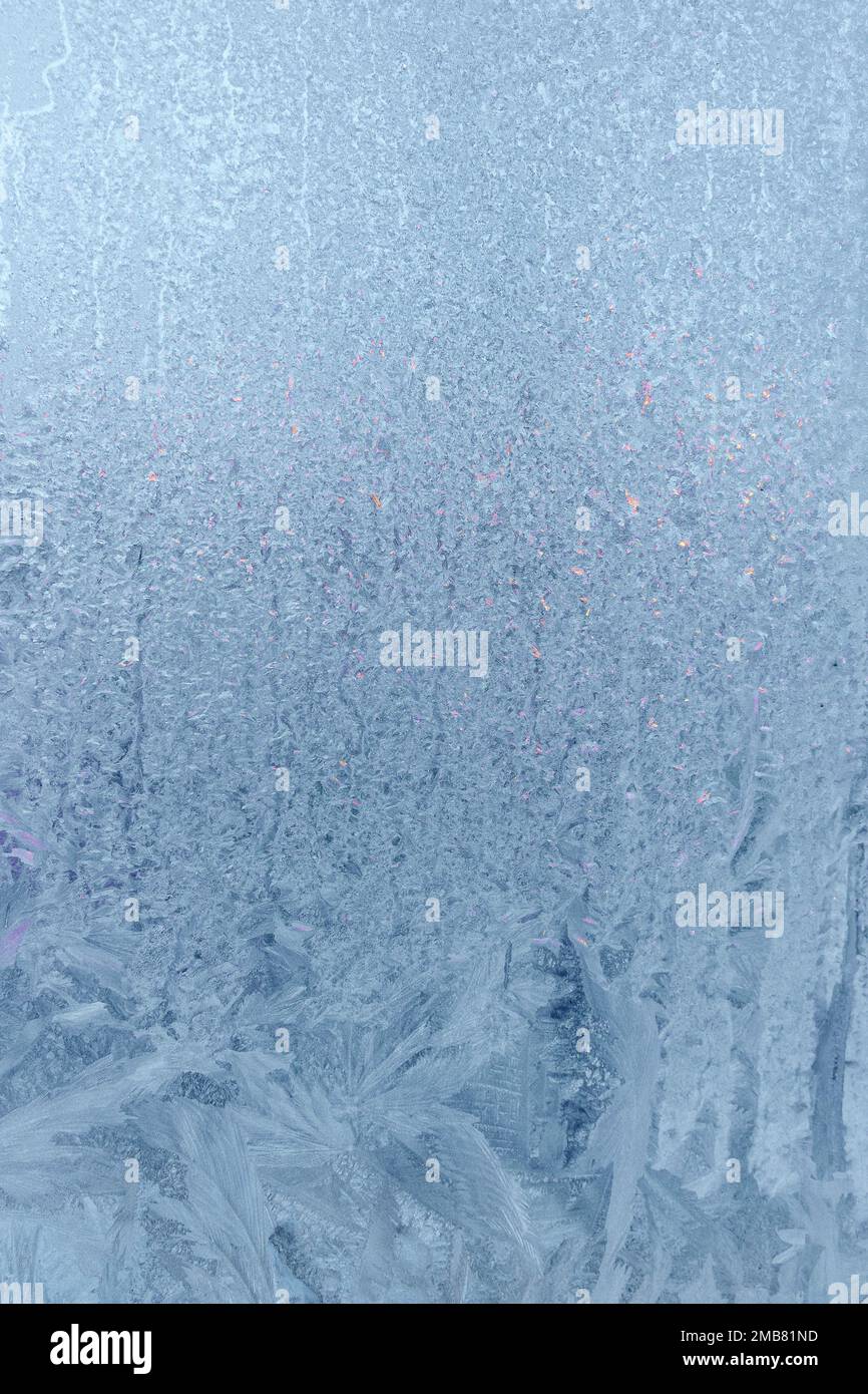 Frozen window, frost drawing on glass in cold winter. Ice texture Stock ...