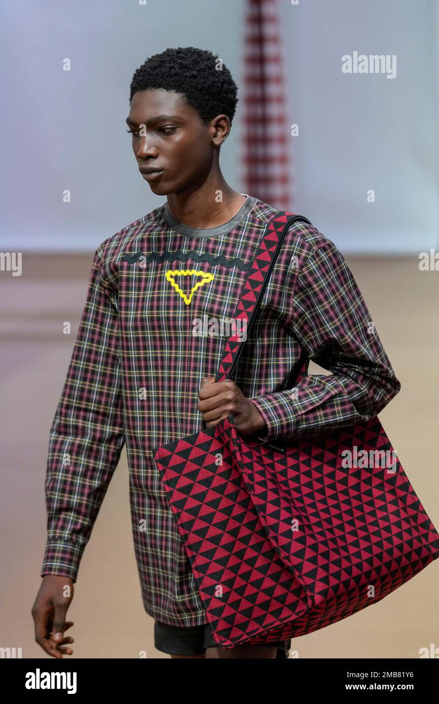 A model wears a creation as part of the Prada men's Spring Summer 2023 ...