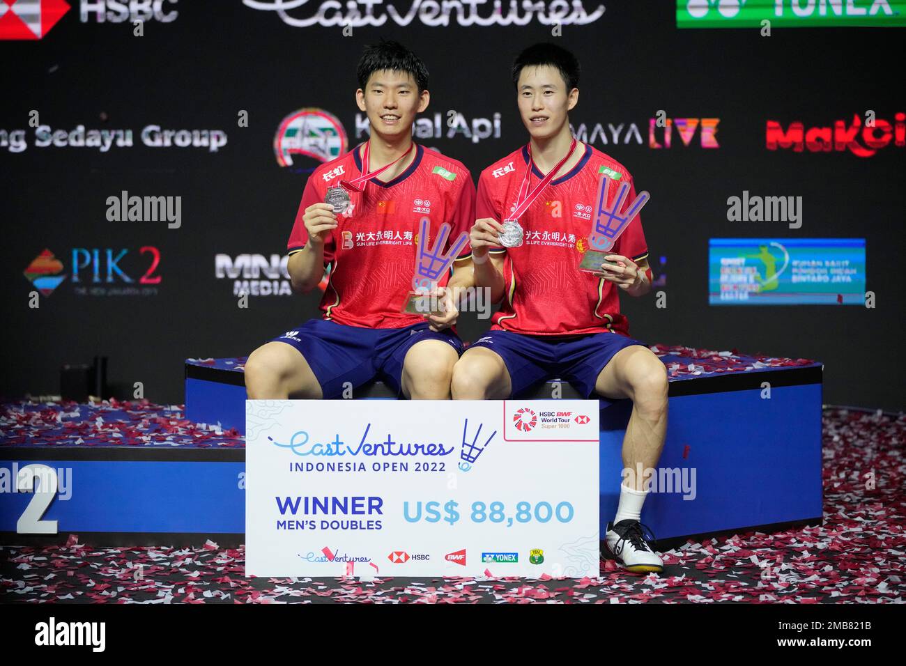 China's Liu Yu Chen, left, and Ou Xuan Yi celebrate with their medals on the podium after ...