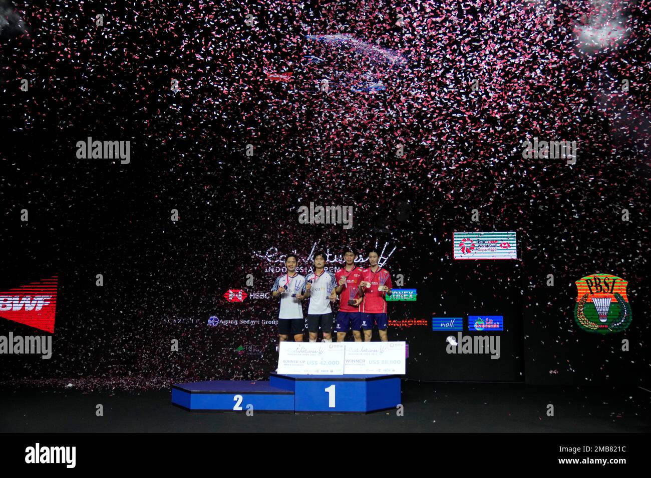 Confetti drops as first place winners Liu Yu Chen, second right, and Ou ...