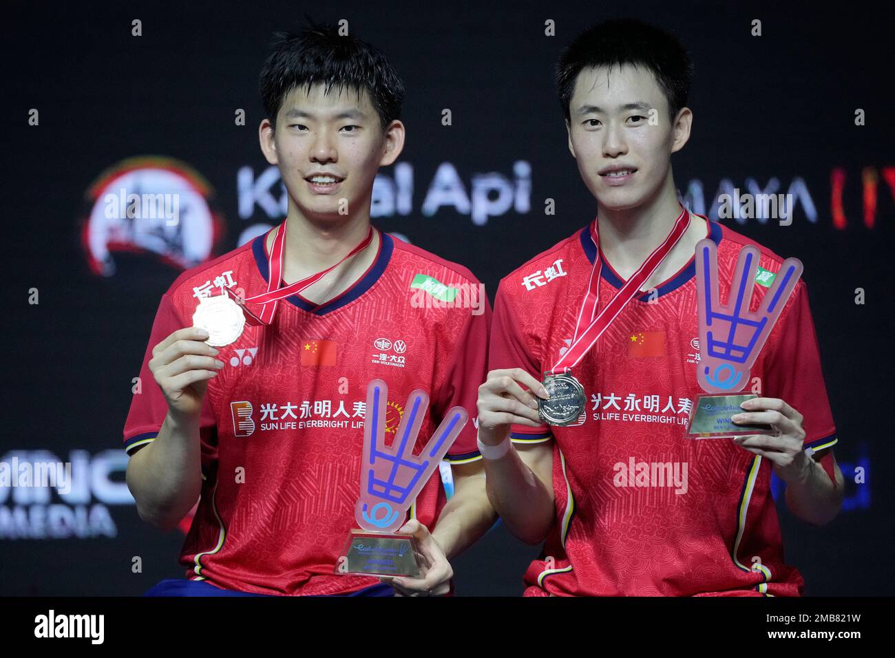 China's Liu Yu Chen, left, and Ou Xuan Yi celebrate with their medals ...