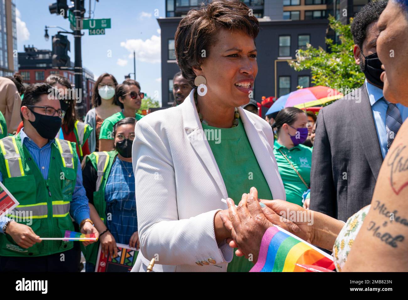 District of Columbia Mayor Muriel Bowser, center, speaks with ...
