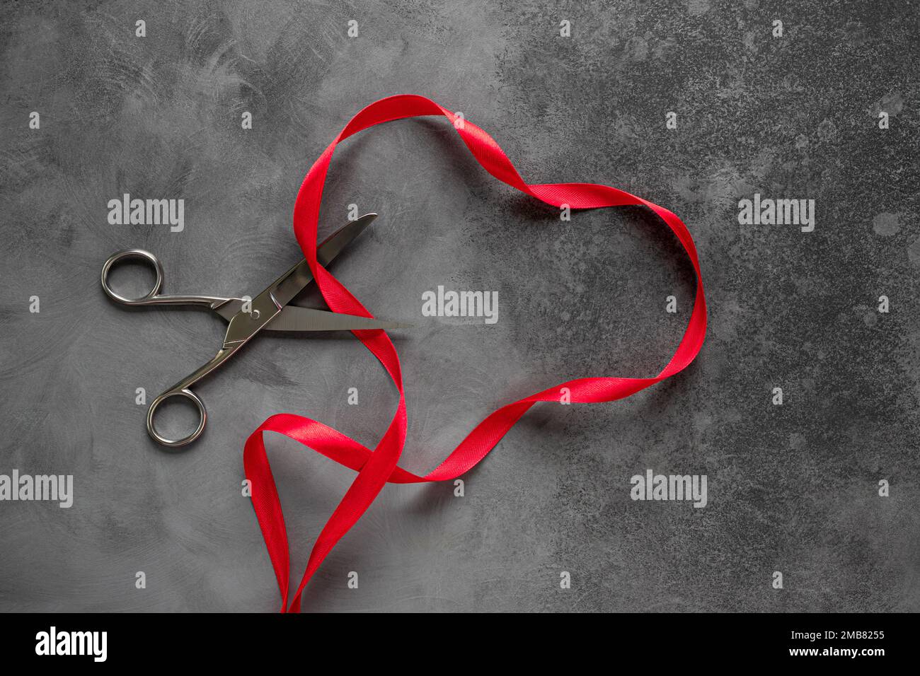 Heart shape from red ribbon and scissors on dark background Stock Photo ...