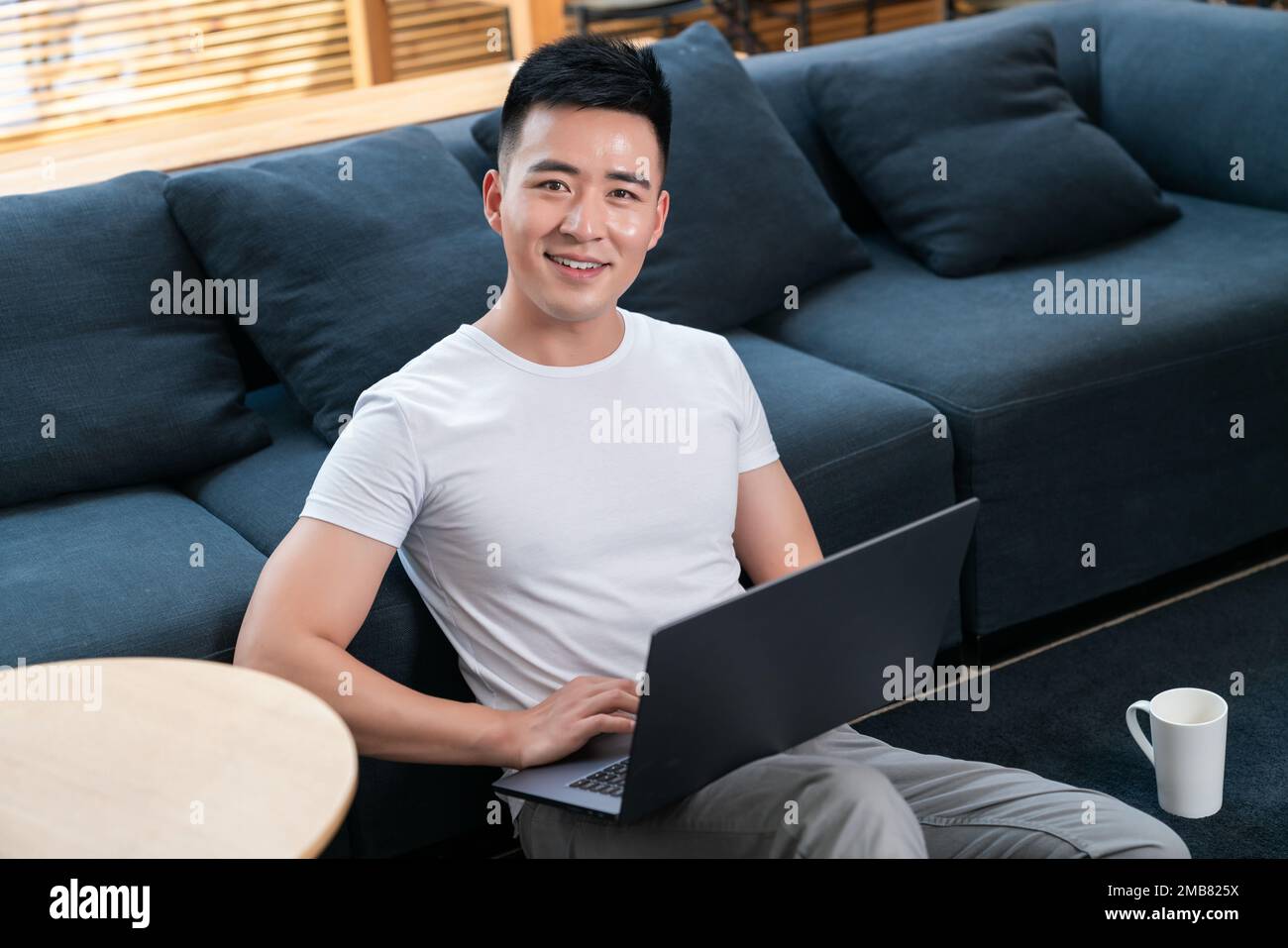 Young men who use a computer Stock Photo - Alamy